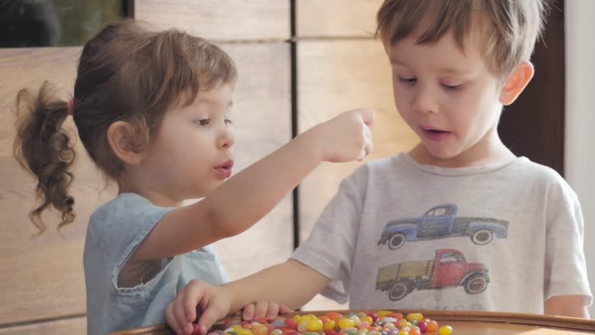 Cute Boy Playing With Colorful Candies Stock Footage Video 1007258359 ...