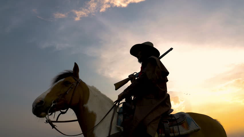 Cowboy Riding Across Grassland with Stock Footage Video (100% Royalty ...