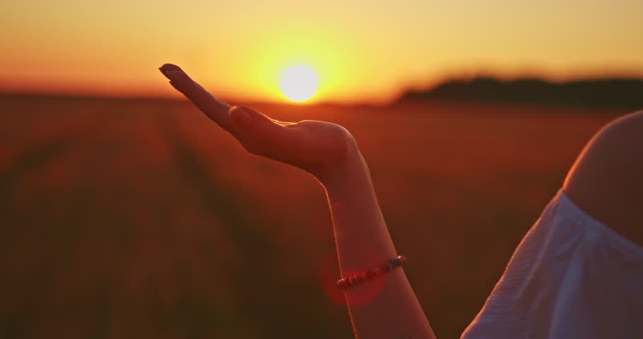 Sun In Hands. Woman Hand Catching A Sun Against Beautiful Sunset On ...
