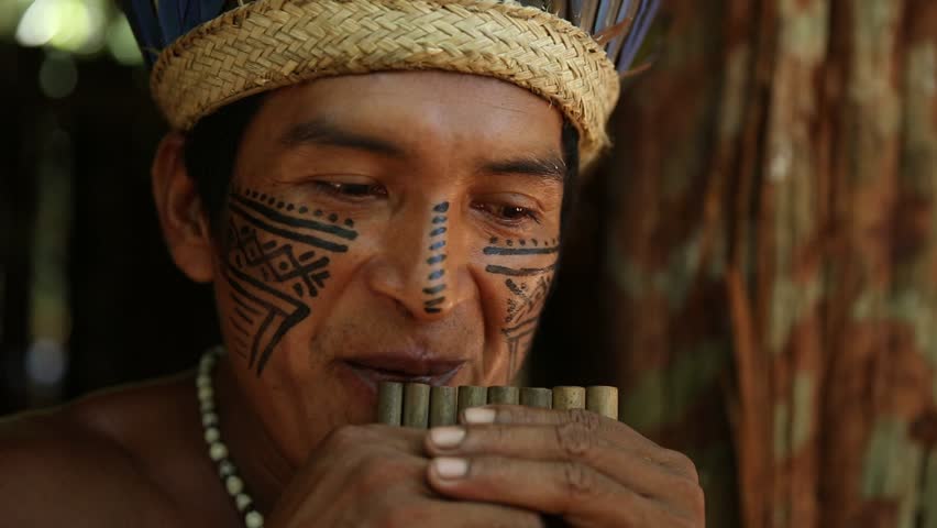 Native Brazilian playing wooden flute at an 스톡 비디오 클립 | Shutterstock
