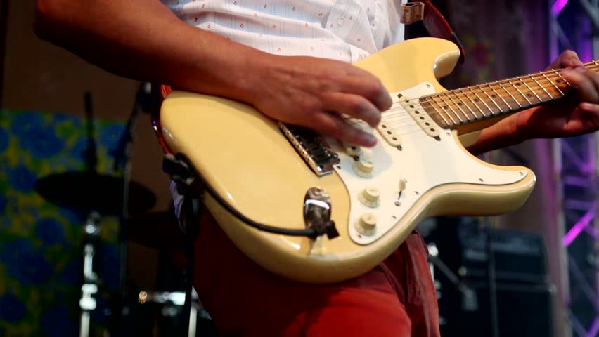 Musician Plays The Guitar During A Concert Videos de metraje en stock ...