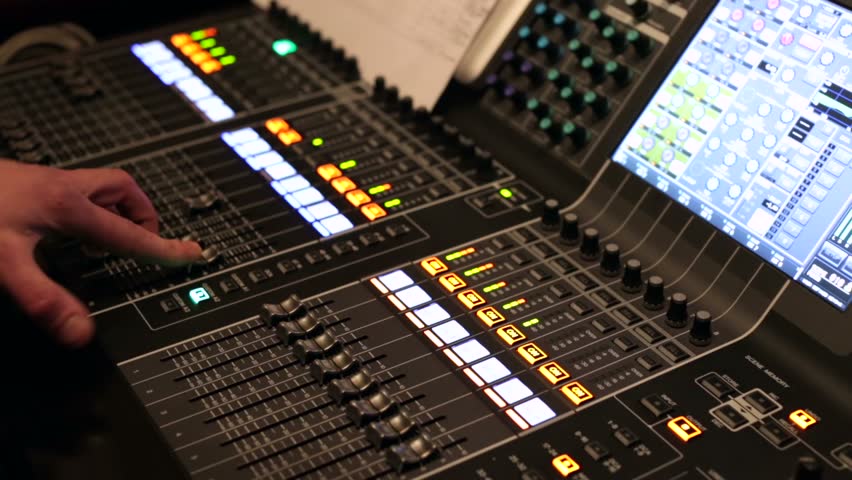 A Man Adjusts A Large Music Mixer With Screens Séquences vidéo libres ...