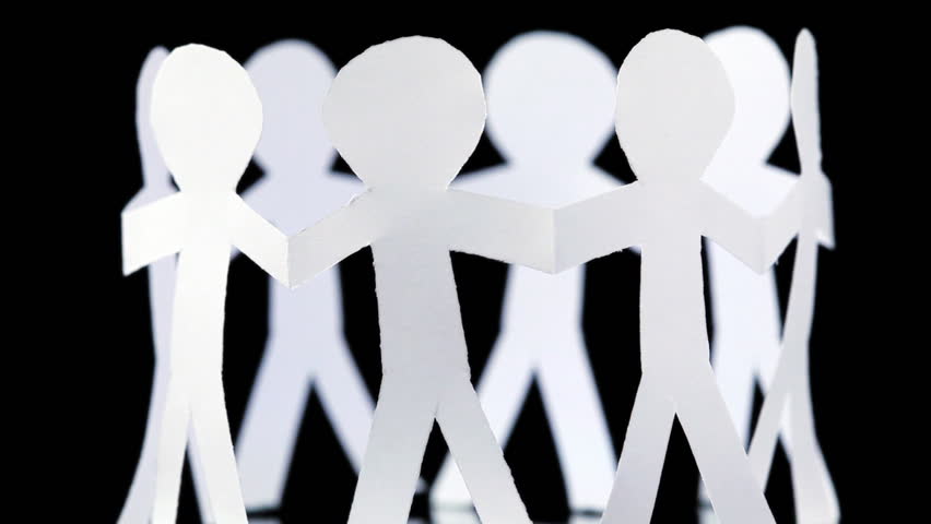 Many Paper People Stand In Circle And Hold Hands, Rotates On Black ...