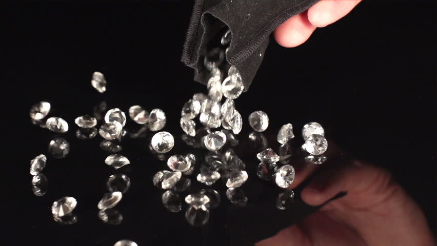 Diamonds Spilling Out Of The Bag On A Black Table Stock Footage Video ...