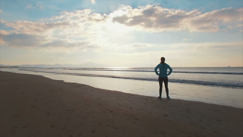 Man Walking Towards Camera On Sandy Beach To The Pacific Ocean In ...