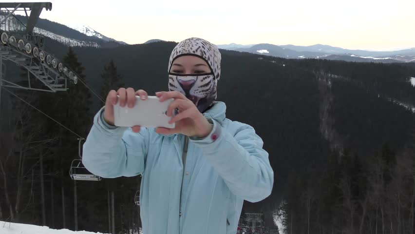 4K Shot Of Girl In Funny Ski Mask Taking Selfie On Mountain Top Stock ...
