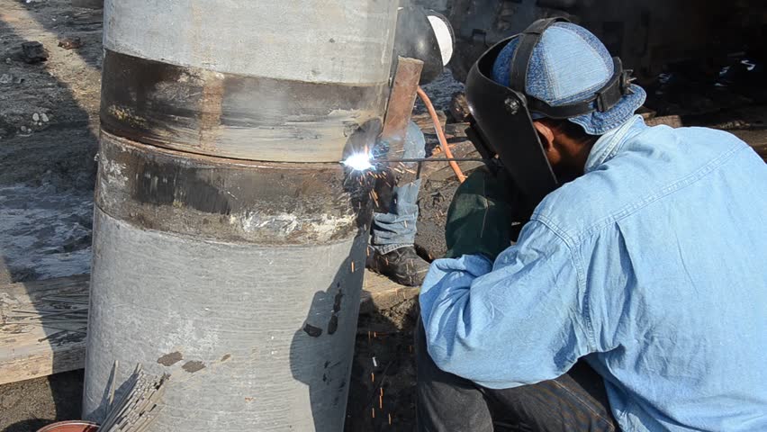 Welder With Protective Equipment Welding Outdoors. HD1080p. Stock ...