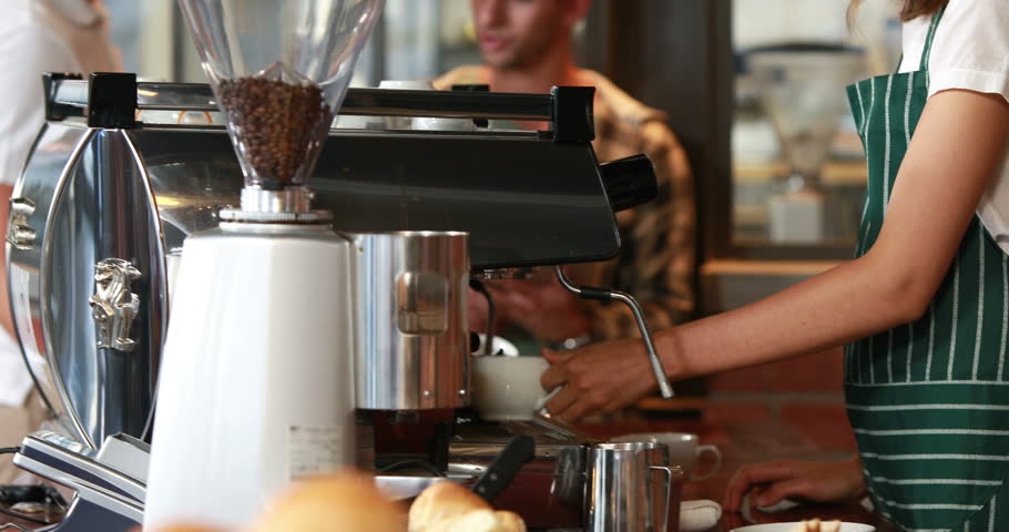 Close Up Of Coffee Dripping In A Pour Over Pulls Out To Passionate ...