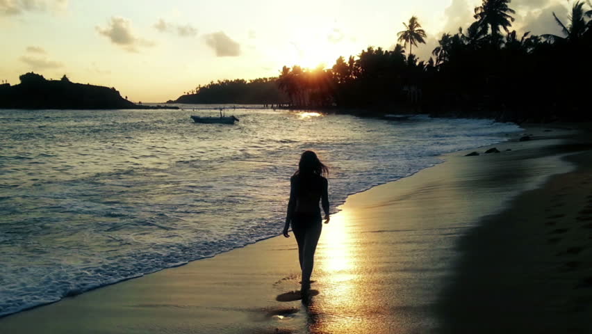 Stockvideo von young woman walking slowly on tropical | 16920244 ...