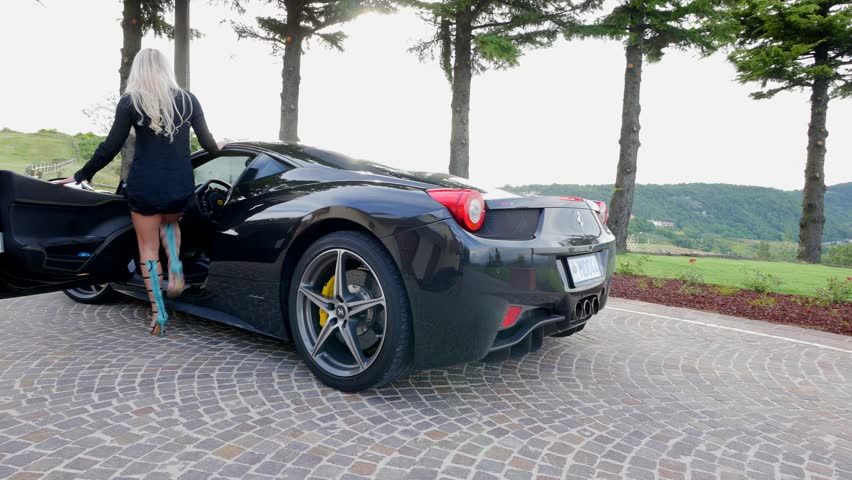 SAN MARINO, ITALY - JUNE 21, 2016: Beautiful Young Woman With Ferrari ...