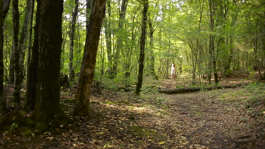 Woman Running Through the Woods. Stock Footage Video (100% Royalty-free ...