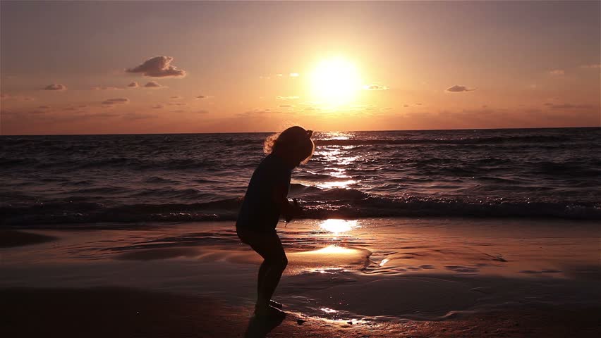 Silhouette Of Attractive Young Bikini Woman Running Into Sunset In ...