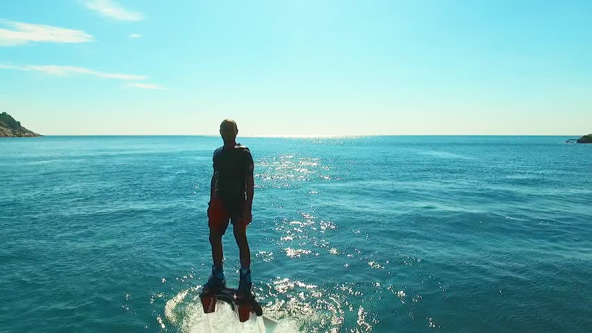 Silhouette Of A Young Man Standing On The Marbella Seashore At Sunrise ...