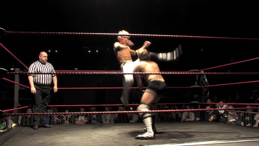 Wrestler Kicks Opponent In Face With A Superkick, Pro Wrestling Match 2 ...