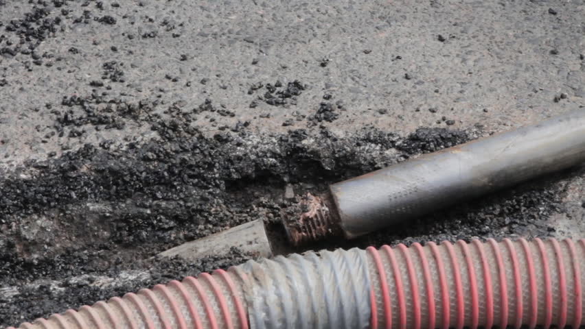 Workers Laying New Sewer Pipes On The Construction Site. Installation ...