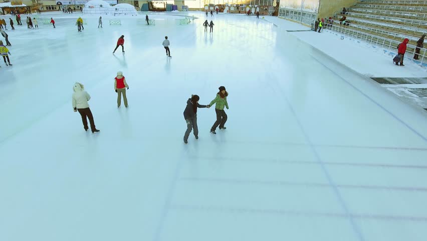 Aerial View From Drone Of Ice Skating Young Woman Outdoor, Ice Rink ...