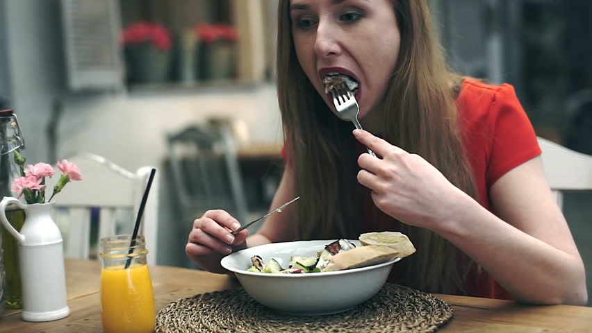 Pretty Girl Eating Delicious Lunch And Drinking Orange Juice, Steadycam ...