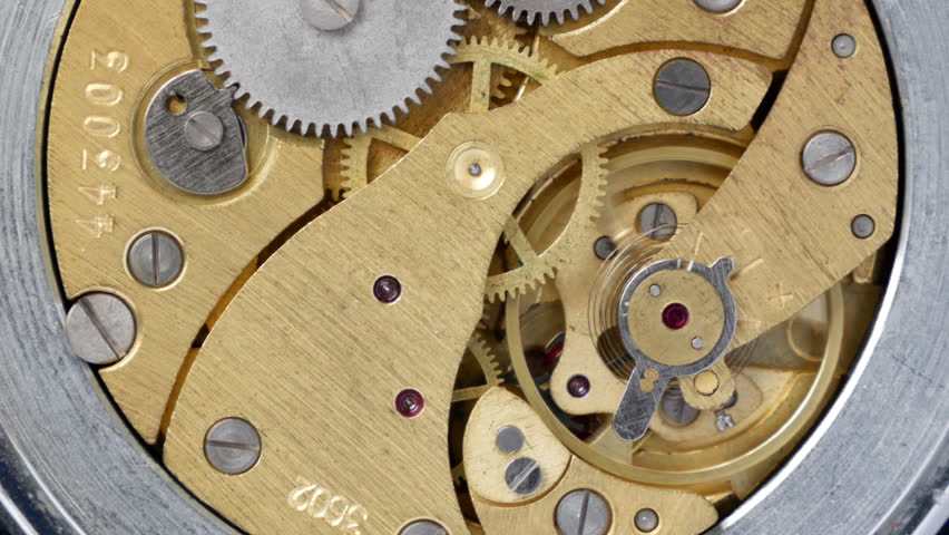 A Slow Panning Macro Shot Of Cogs Spinning Inside A Watch. Stock ...