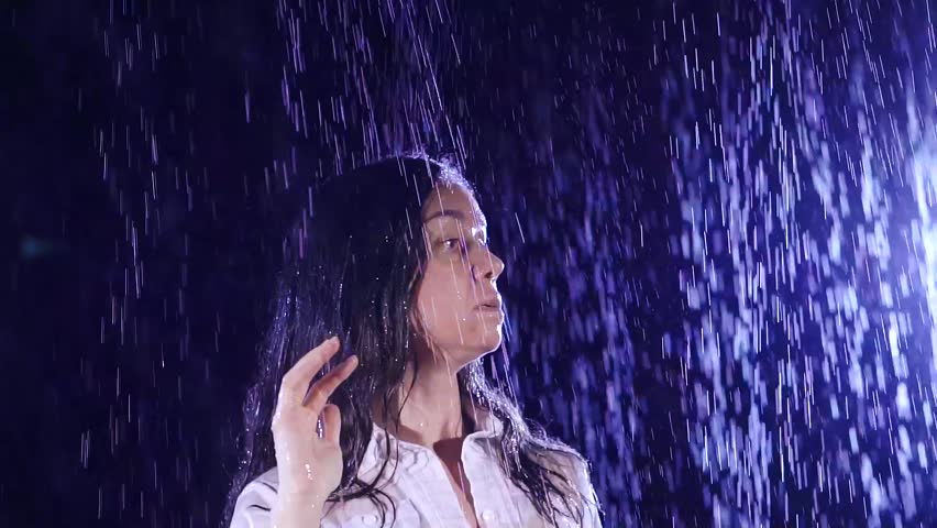 Soaking Wet Woman Standing In The Pouring Rain In The Dark Stock ...