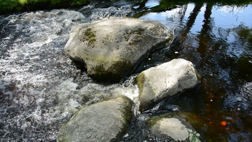 Stock Video Clip of big stones in summer river water stream | Shutterstock
