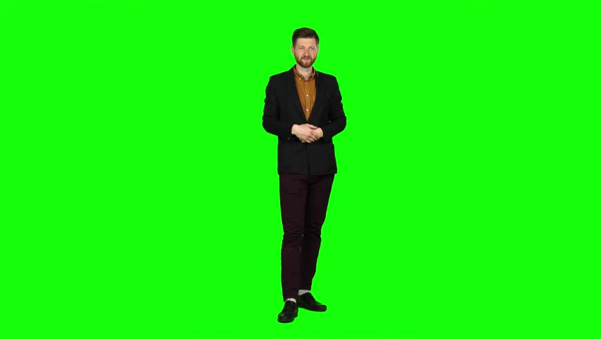 Portrait Of Young Man Standing Against Green Screen. Male Person People ...