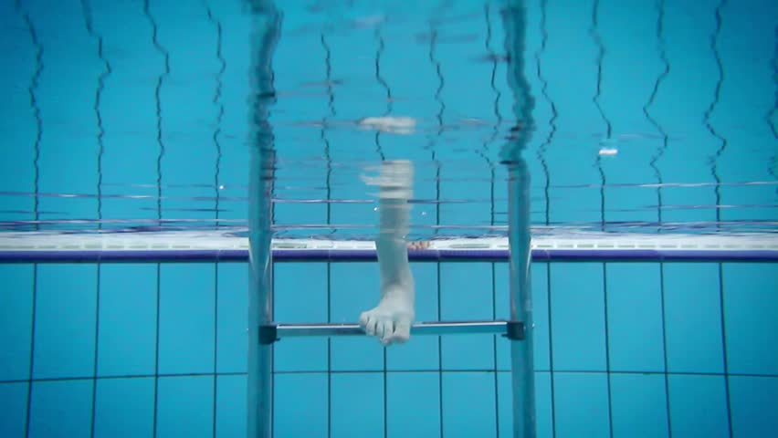 Person Walk In To Pool Close Up. Underwater View Of Person Legs Walking ...