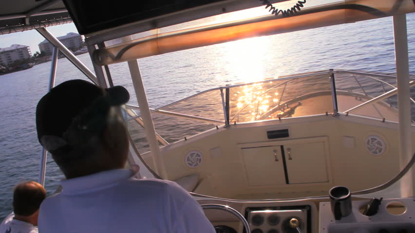 Stock Video Clip of Deep Sea Fishing Captain drives boat at | Shutterstock