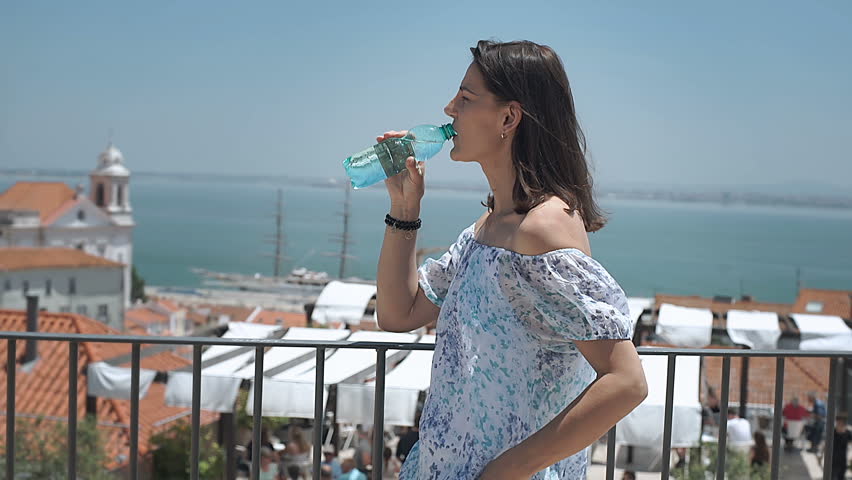 Beautiful Women Sitting At A Seaside Cafe And Drinking A Coffee.High ...