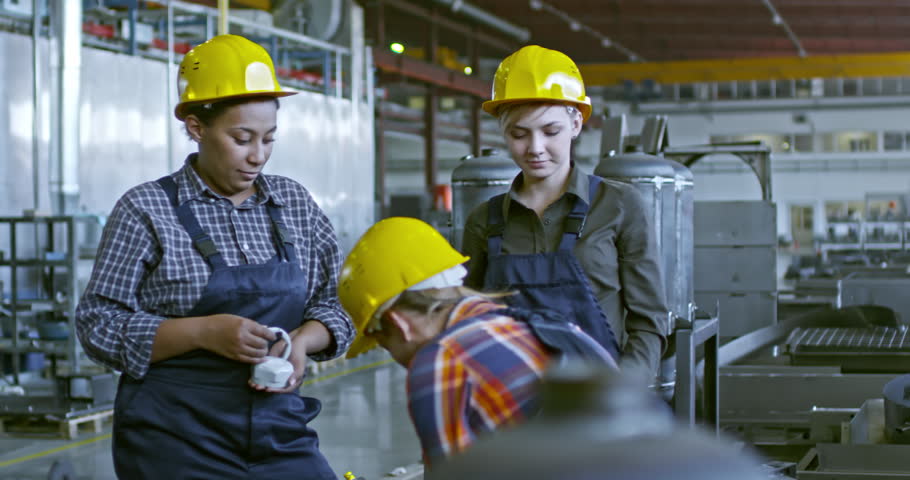 Tracking Slowmo Of Young Female Factory Technician In Hardhat Working ...