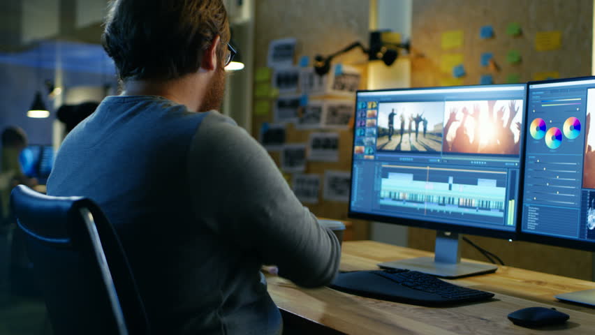 Male Videographer Edits and Cuts Stock Footage Video (100% Royalty-free ...