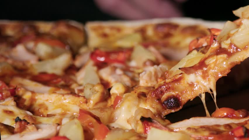 Slow Motion Close-up Of Drooping Slice Of Pepperoni Pizza Cooked In ...