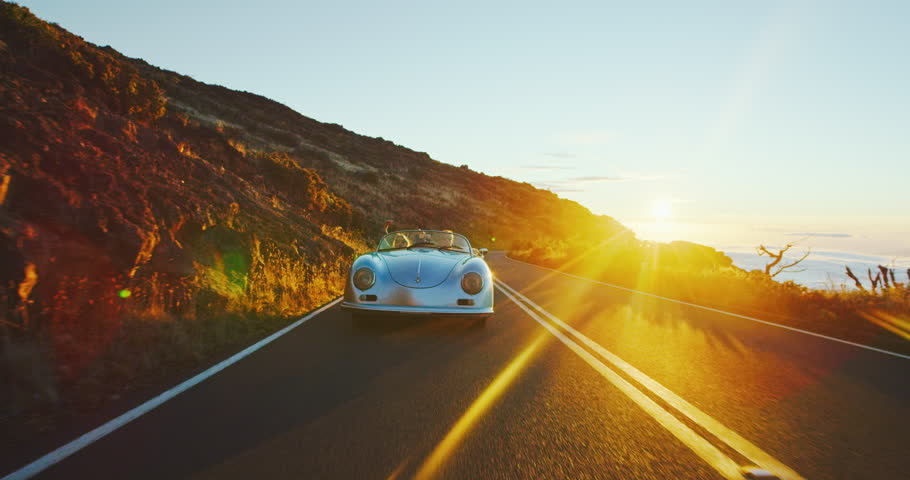 Car Driving Into Sunset