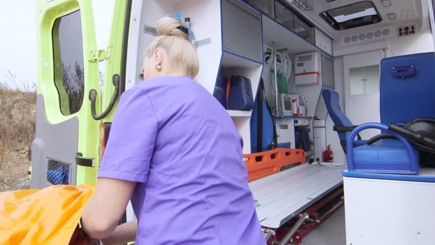 EMT Provide Emergency Medical Care For Critical Senior Patient In ...