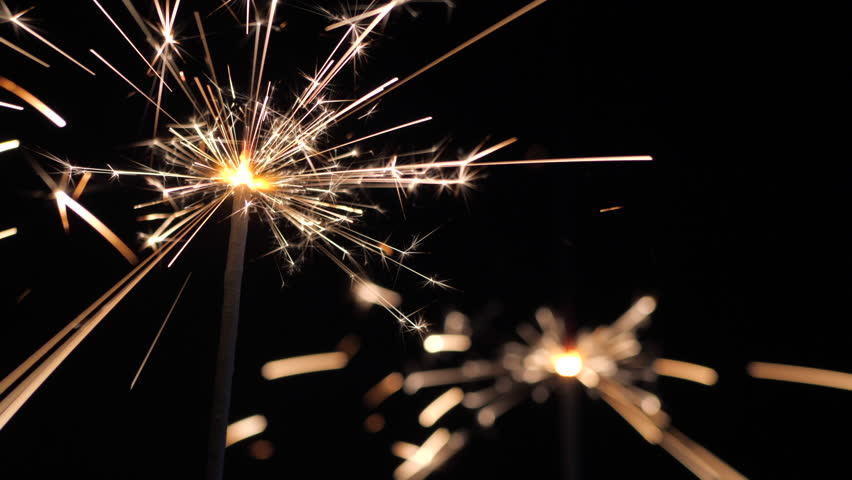 Two Sparklers Over Black. Gun Powder Sparks Shot Against Deep Dark ...