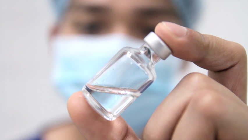 Nurse Inspecting a Vial of Stock Footage Video (100% Royalty-free ...