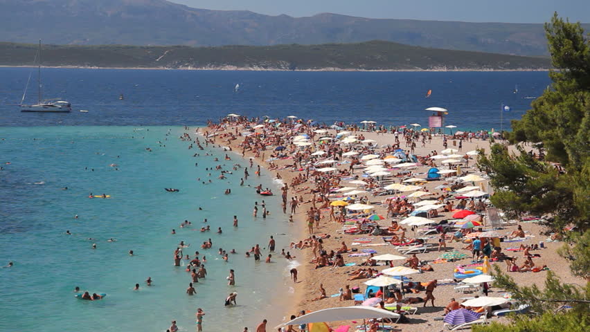Stock video of people on the beach, sunbathe and | 3614084 | Shutterstock