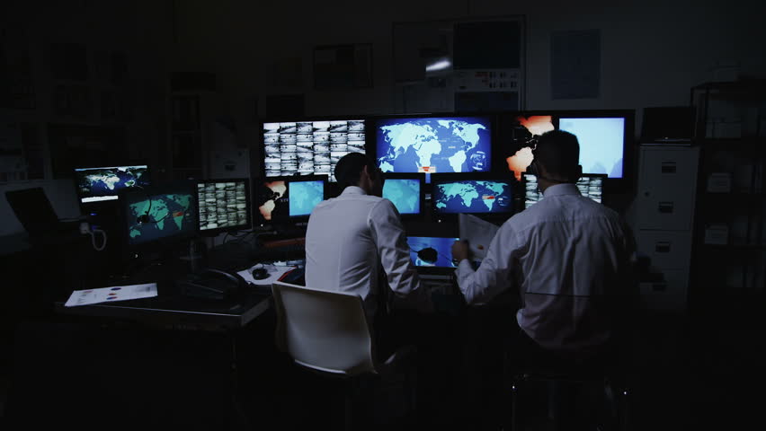 Group Of Military IT Professionals On Briefing In Monitoring Room On ...