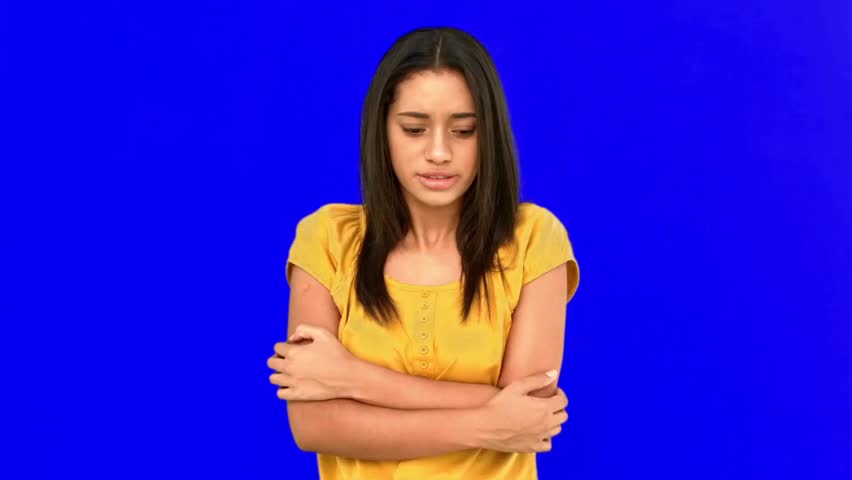 Stock video of woman shivering with cold on blue | 4050394 | Shutterstock