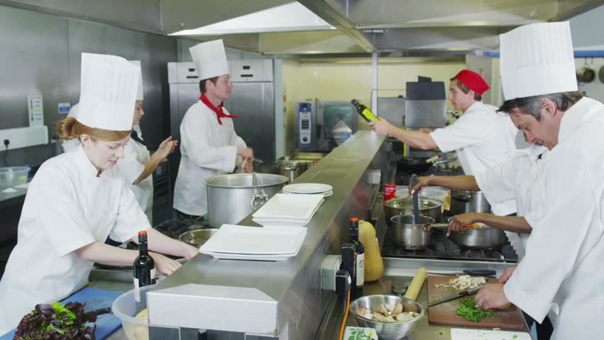 Time Lapse Clip Of A Busy Team Of Chefs, Working Hard And Preparing ...
