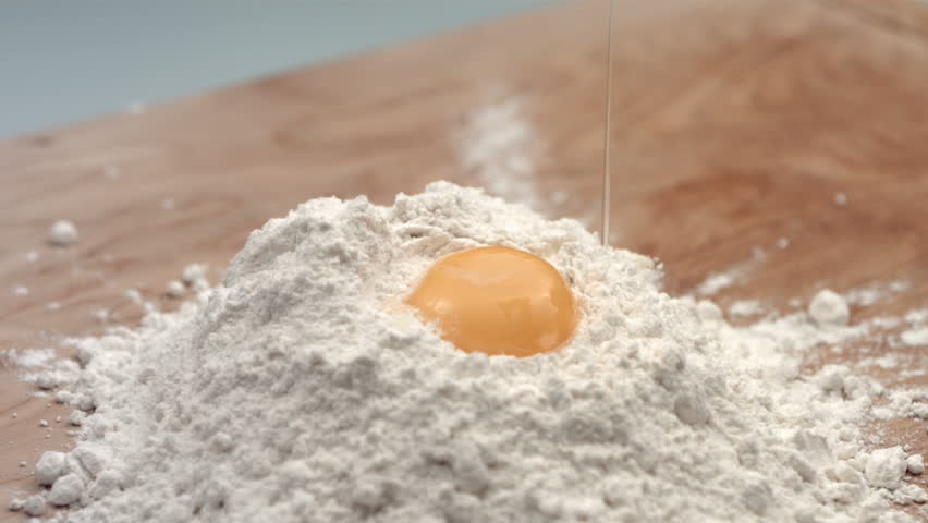 Egg Dropping Into Flour, Slow Stock Footage Video (100% Royalty-free ...