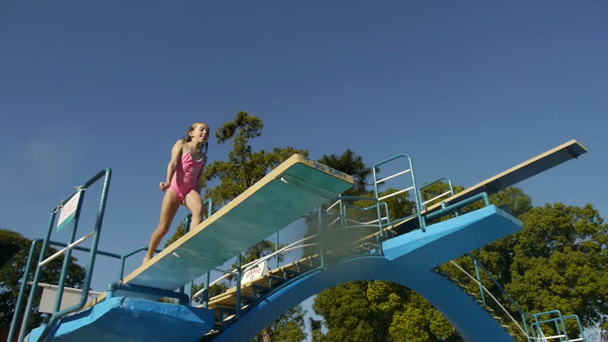 Girl Jumping From Springboard And Diving In Swimming Pool -Slow Motion ...