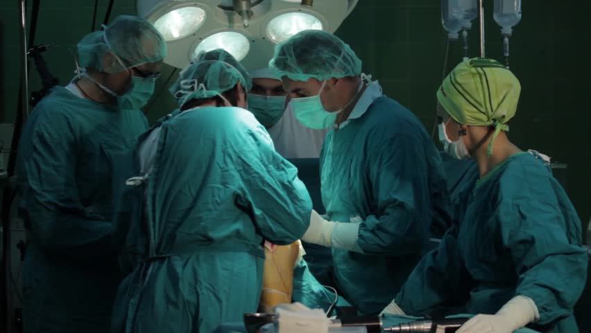 Stock video of surgeons team preforming operation in hospital | 5583644 ...
