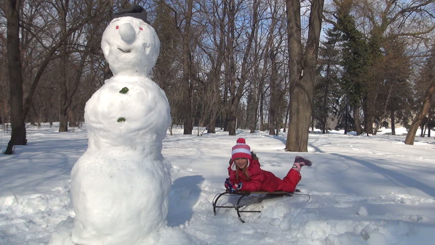 Little Girl Playing On Sled, Sledge By A Snowman In Park, Child, Kid In ...