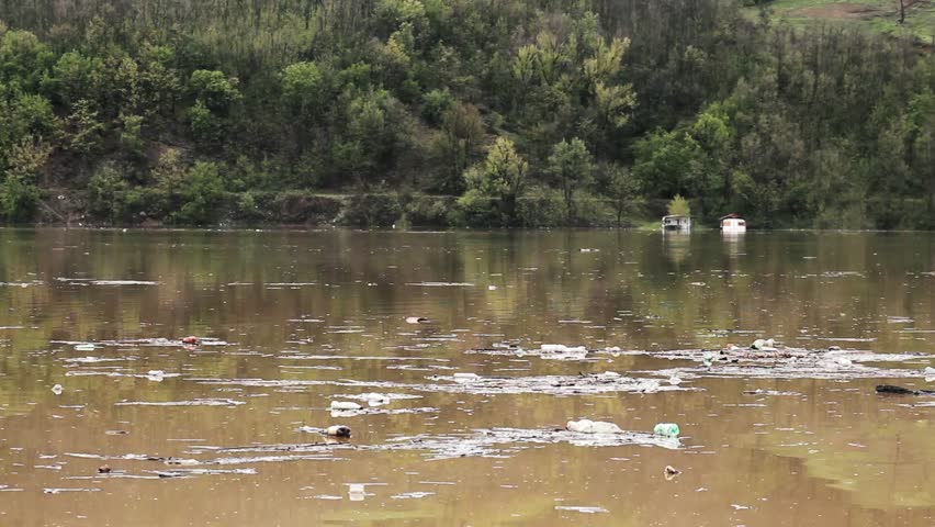 Garbage Floating In The Water After Heavy Downpour,rain Falling,plastic ...