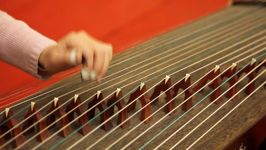 Chinese Traditional Musician Playing Chinese Guzheng.Guzheng, Also ...