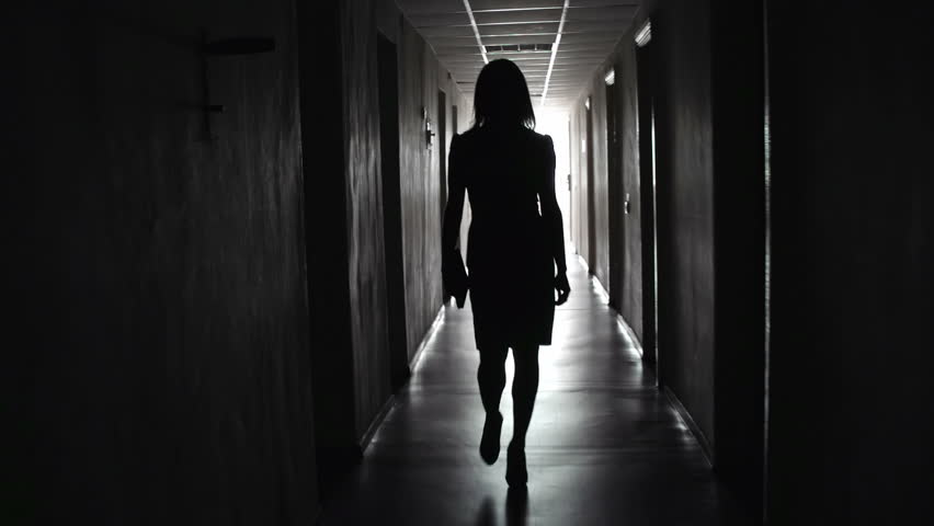 Camera Following Business-like Unrecognizable Lady Tripping Along Dark ...