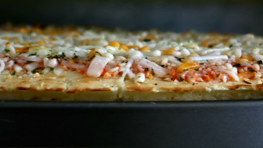 Slow Motion Close-up Of Drooping Slice Of Pepperoni Pizza Cooked In ...