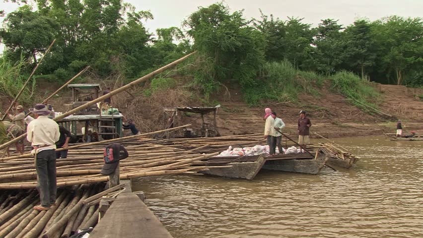 A Logging Boom Boat Is Moored Alongside A Fast Moving River/Boom Boat/A ...