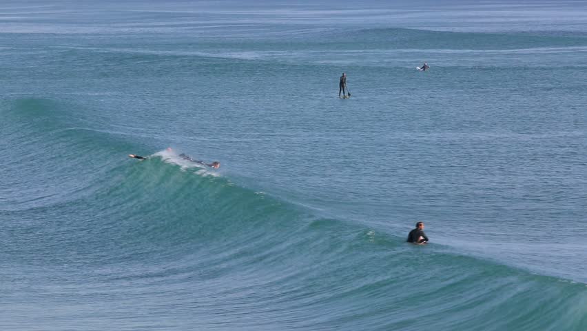 Surfers Sharing Waves with a Stock Footage Video (100% Royalty-free ...