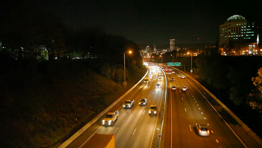 PORTLAND, OR - 2013 - Cars Drive Down A One-way Street At Night In ...